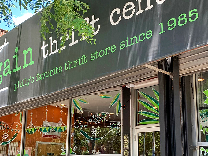 The iconic green and black storefront of Bargain Thrift Center has been welcoming treasure hunters to South Street since 1985, promising adventures in affordable shopping.