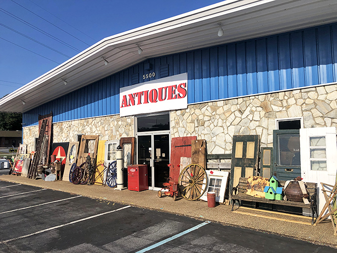 The blue facade with stone accents isn't just a building&mdash;it's a portal to treasures waiting to be discovered. Antiques spill onto the sidewalk, offering a tantalizing preview.