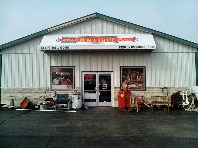 The unassuming exterior of Coldwater Antique Mall hides a universe of treasures inside, like finding the TARDIS of vintage collectibles in rural Michigan.
