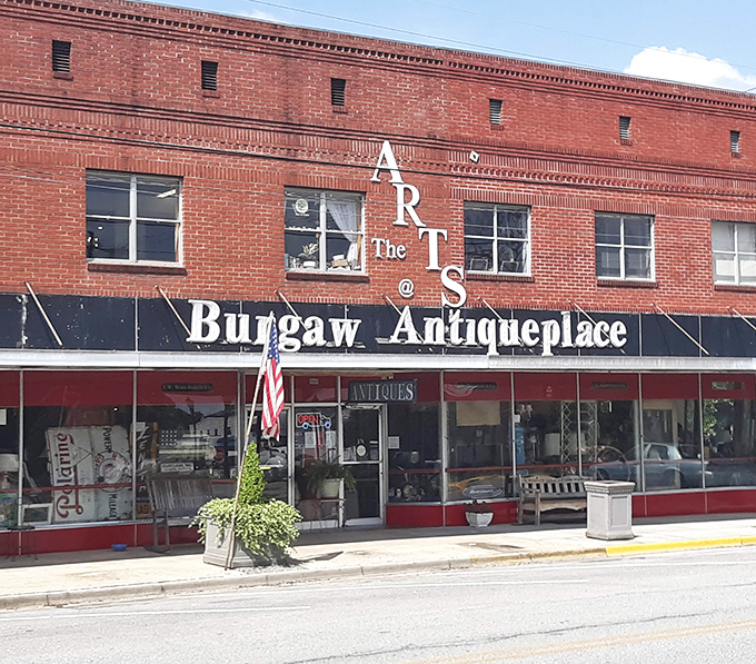 The iconic red brick fa&ccedil;ade of Burgaw Antiqueplace stands like a time capsule on the main street, beckoning treasure hunters with its vintage charm.