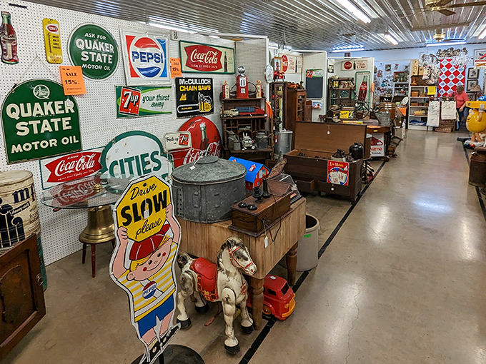 Nostalgia heaven! Vintage advertising signs from Quaker State, Coca-Cola, and Pepsi create a time-traveling wonderland that would make Don Draper weep with joy.