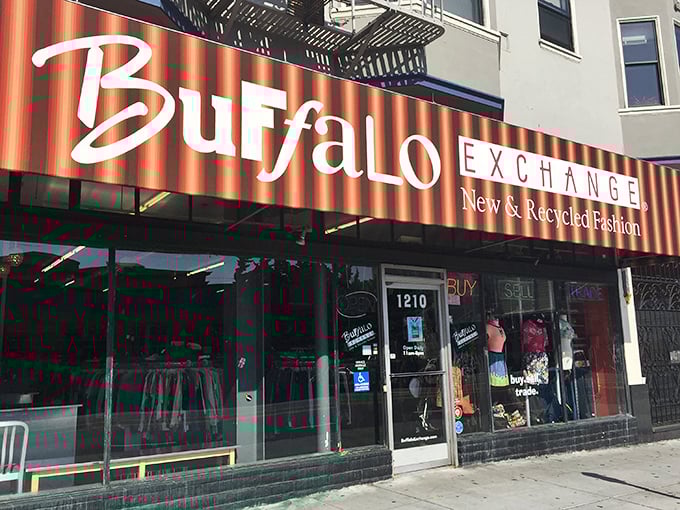 The iconic red-striped Buffalo Exchange storefront beckons fashion hunters like a beacon of sustainable style on Haight Street.