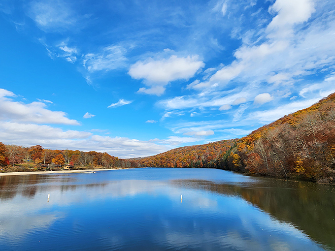 Mirror, mirror on the lake &ndash; autumn's fiery palette doubles its splendor on Laurel Hill Lake's glass-like surface. Nature showing off at its finest! 