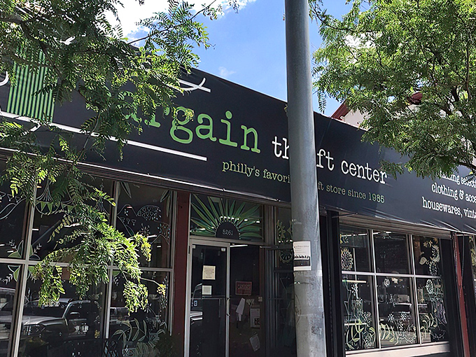 The iconic green and black storefront of Bargain Thrift Center has been welcoming treasure hunters to South Street since 1985, promising adventures in affordable shopping.