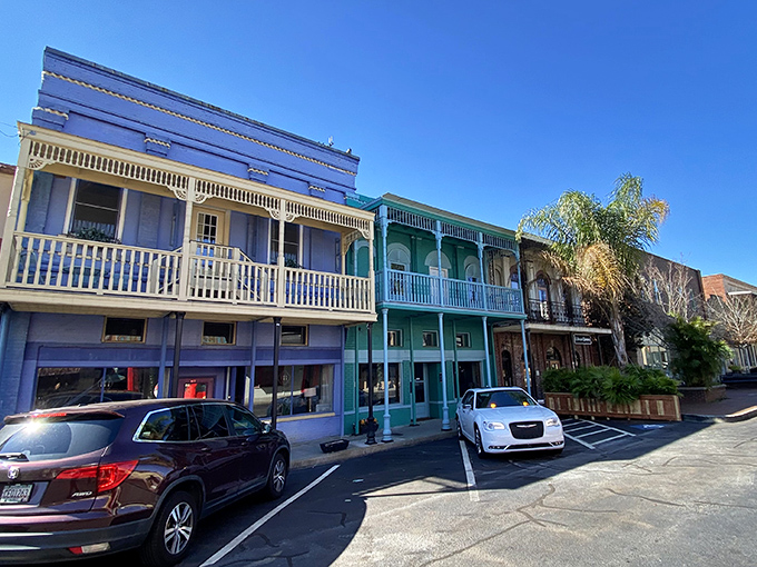 Victorian charm on full display! These pastel-colored storefronts with ornate balconies transport you to a time when conversations happened on porches, not phones.