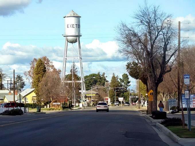 That iconic water tower stands like a friendly giant, welcoming visitors to Exeter's charming embrace.