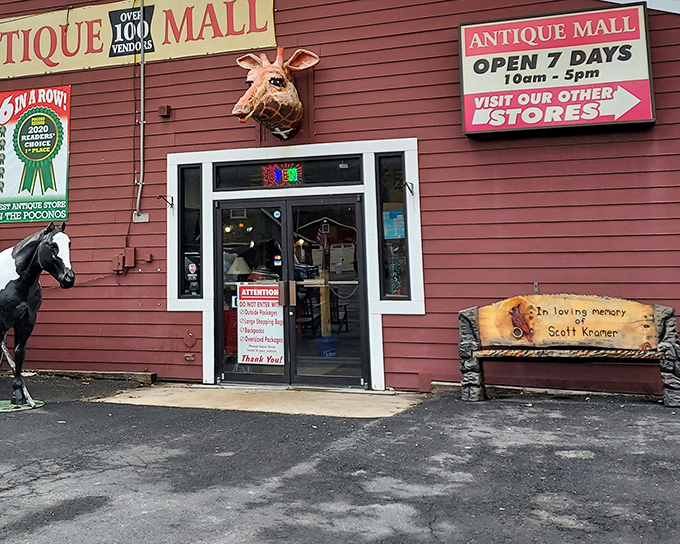 The unassuming exterior of Pocono Peddler's Village Antique Mall, where rocking chairs invite you to rest before or after your treasure hunting expedition.