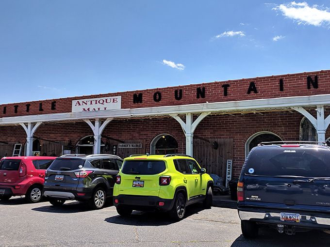 The brick fa&ccedil;ade with white columns isn't just charming&mdash;it's a time portal disguised as architecture. American flags flutter like welcome banners to treasure hunters.