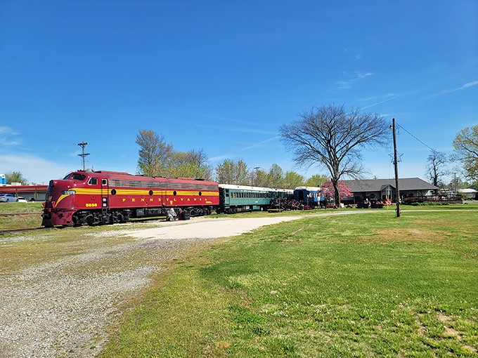 The crimson and gold locomotive sits majestically against the blue Missouri sky, like a time machine ready to whisk you back to the golden age of rail travel. 