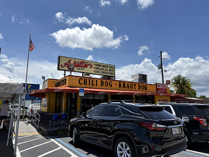 The bright yellow building with bold red awnings isn't trying to be subtle &ndash; it's proudly announcing that serious hot dog business happens here.