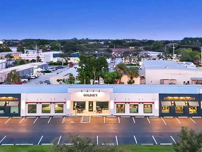 Goldie's unassuming white exterior might fool you, but those vintage gooseneck lights are practically winking, "Trust me, the breakfast magic happens inside."