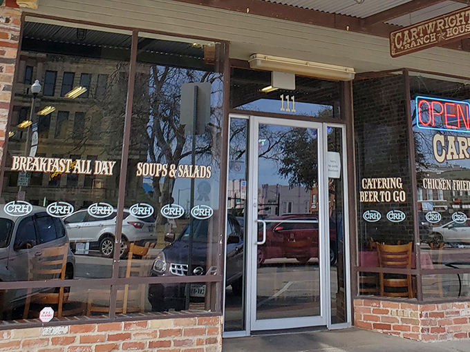 The purple sign beckons like a Texas-sized promise &ndash; Cartwright's Ranch House isn't just a restaurant, it's a declaration of comfort food devotion.