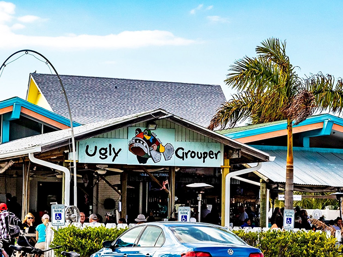 The Ugly Grouper's cheerful exterior belies its name, welcoming hungry beachgoers with tropical vibes and the promise of seafood paradise.