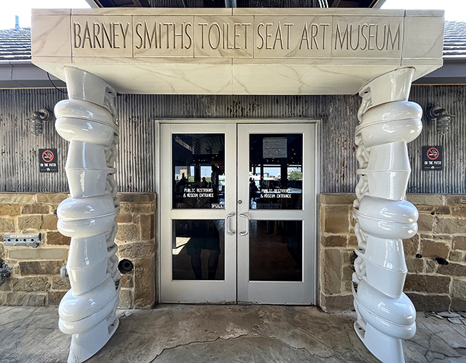 Wall-to-wall wonder! Inside of Barney Smith's Toilet Seat Art Museum showcases hundreds of decorated seats, creating an unexpectedly mesmerizing visual experience.