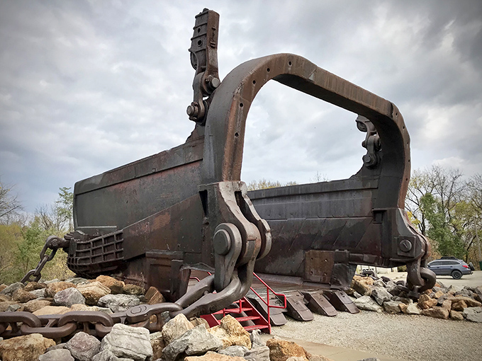 The rusting giant sits like a prehistoric creature taking a break from earth-moving duties. Industrial history never looked so impressively massive.