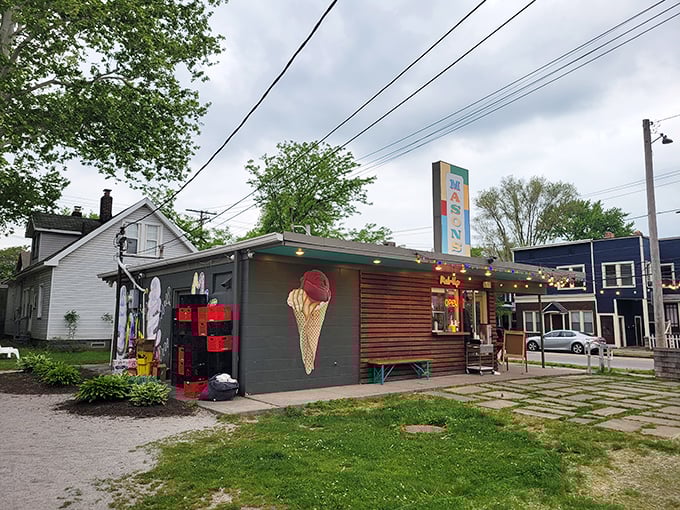 Mason's Creamery stands like a sweet oasis in Cleveland's Ohio City neighborhood, its colorful sign promising frozen delights under string lights and summer skies.