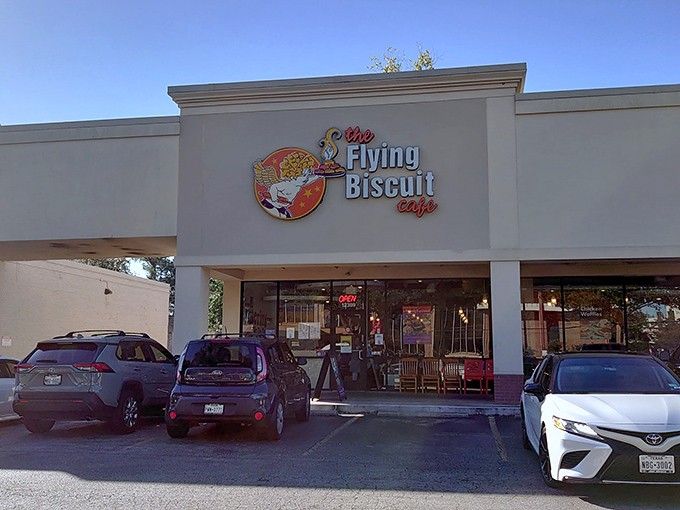 That cheerful storefront sign promises biscuit bliss, and boy does it deliver on every buttery word.