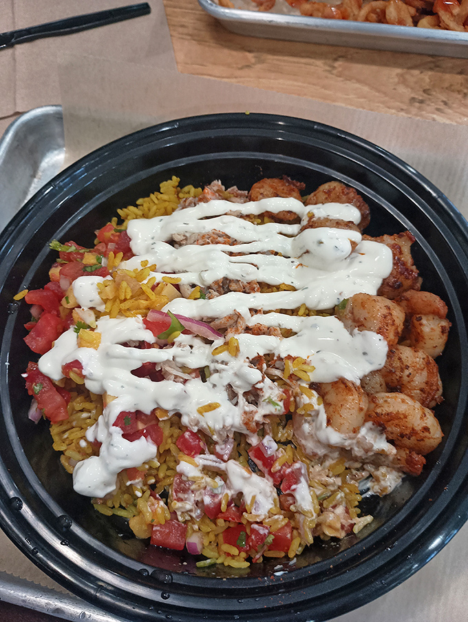 This seafood bowl is what happens when grilled perfection meets colorful companions &ndash; a harmony of flavors drizzled with creamy sauce.