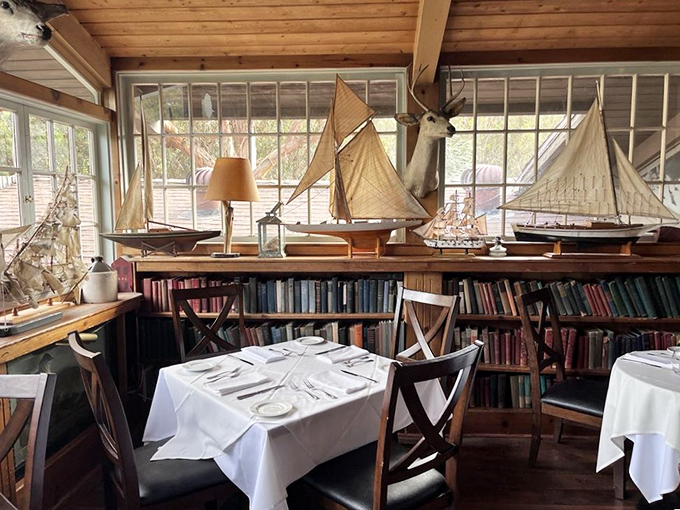 Upstairs dining surrounded by books and model ships creates intimate conversations over exceptional meals below.
