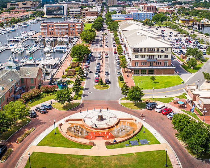 Another aerial view of Pensacola's waterfront district, where boats, buildings, and boulevards create a perfect urban seaside symphony. No filter needed.