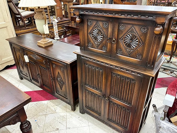 Carved wooden cabinets that whisper tales of Sunday dinners past, waiting patiently for their next chapter in someone's home.