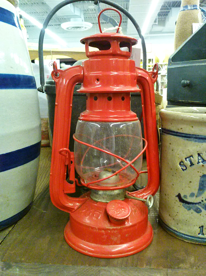 This gleaming red lantern once guided someone home through darkness. Now it's ready to bring vintage warmth to a modern space.