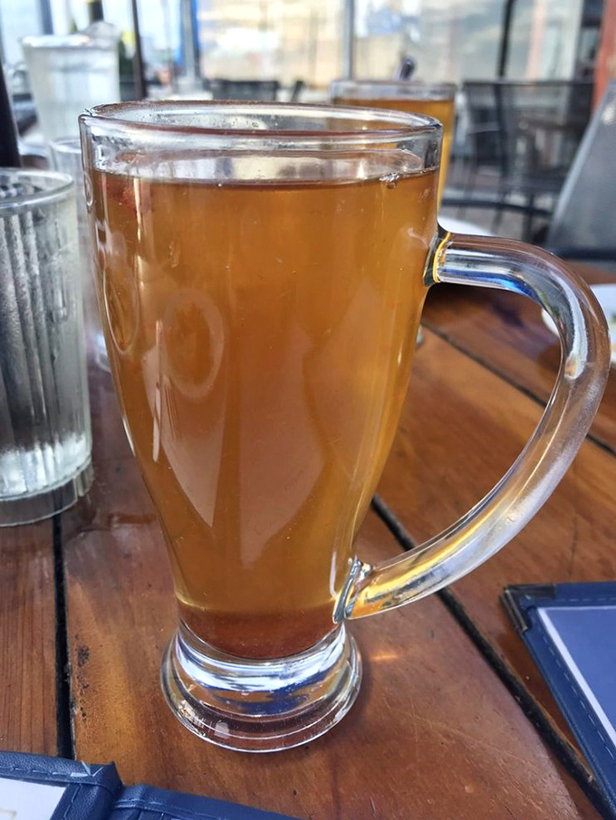 This isn't just apple cider—it's liquid sunshine in a glass, perfect for sipping while watching sailboats dance across the harbor.