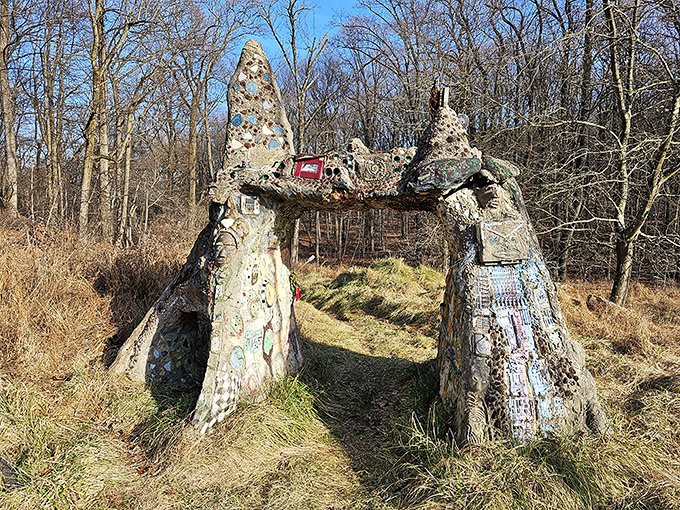 Winter reveals the arch's stark beauty, its embedded treasures and intricate details standing out against the dormant landscape like jewels in a crown.