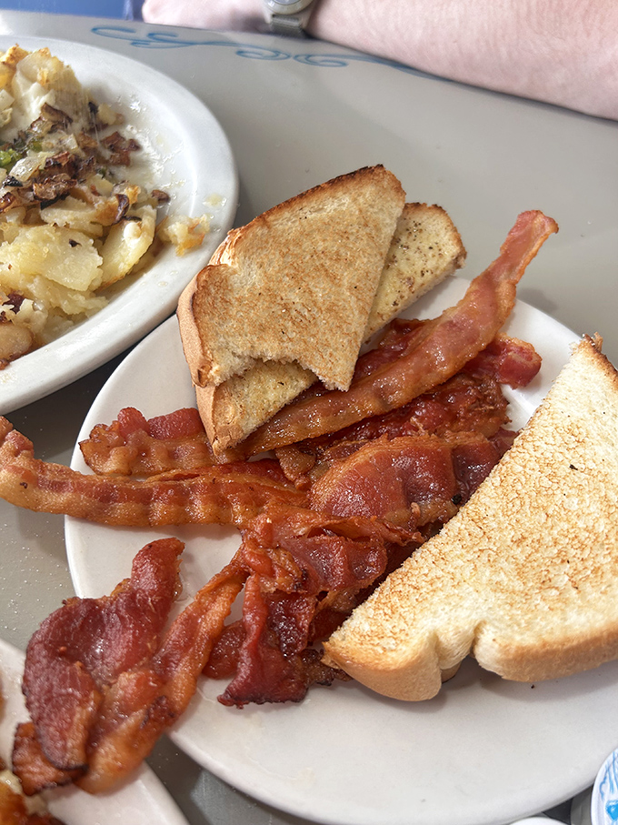 Bacon cooked to that perfect sweet spot between chewy and crisp, with toast standing by for sandwich-making opportunities.