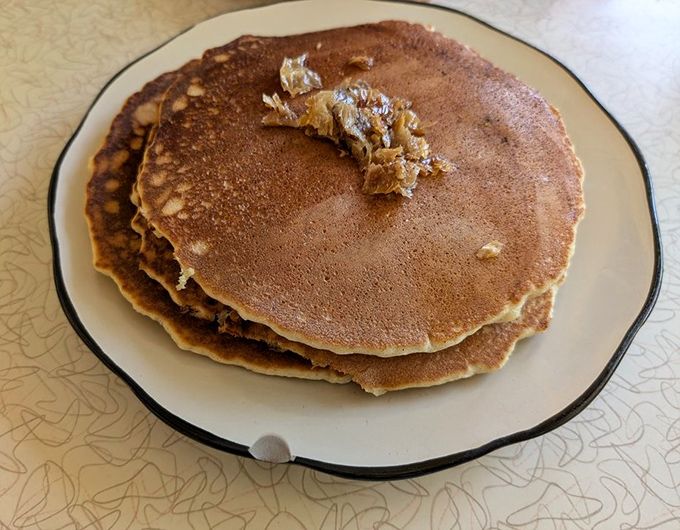 Pancakes this perfect don't need fancy toppings, though that pat of butter melting into warm goodness suggests they deserve the royal treatment.