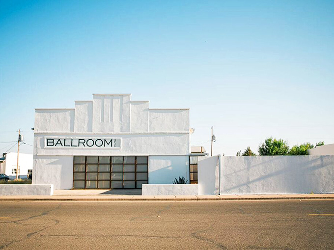 Ballroom Marfa's stark white façade is the ultimate blank canvas—a former dance hall transformed into a cultural hub where art and West Texas collide beautifully.