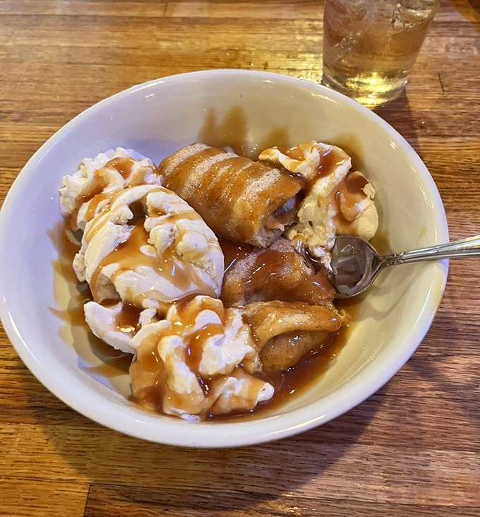Comfort in a bowl—creamy banana pudding topped with what appears to be caramelized bananas. Dessert that makes you close your eyes and sigh with contentment.