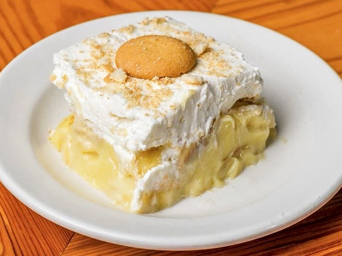 Banana pudding that makes grown adults fight over the last vanilla wafer—a dessert so nostalgic it should come with a permission slip to your childhood.