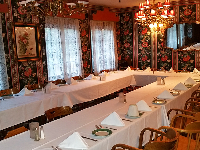 The banquet room's floral wallpaper and pristine tablecloths whisper tales of anniversary celebrations and retirement parties done right.
