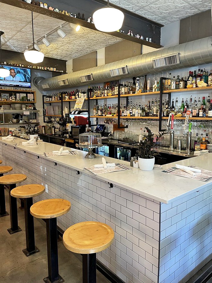 Pull up a stool at the white-tiled bar where crafted cocktails and friendly conversation flow with equal abundance.