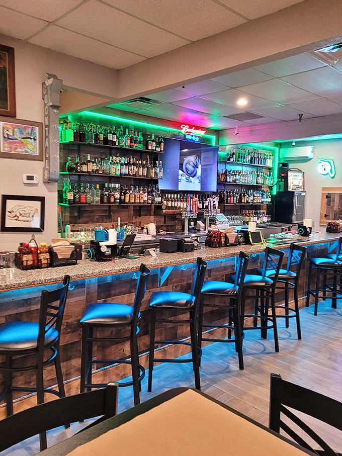 The bar area glows with promise, offering liquid companions to complement your smoky feast. BBQ and bourbon&mdash;a match made in Florida heaven.