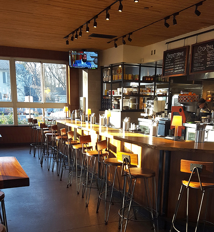 The bar counter gleams with potential adventures in liquid form. Those wooden stools have heard thousands of stories, each more interesting than the last.