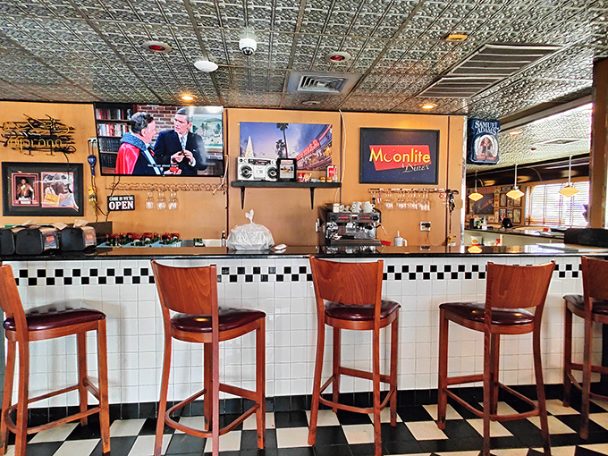 Pull up a stool at the counter bar where the checkered pattern continues and vintage signs remind you that some things never go out of style.
