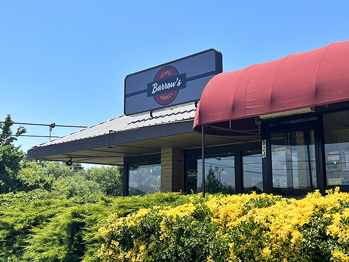 Barrow's Cafe peeks out from behind sunny foliage, promising comfort food that makes chain restaurants seem like they're not even trying.