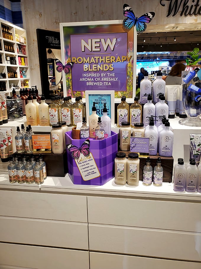 Bath & Body Works' aromatherapy display &ndash; where butterfly decorations and purple packaging promise to transform your shower into a spa retreat.