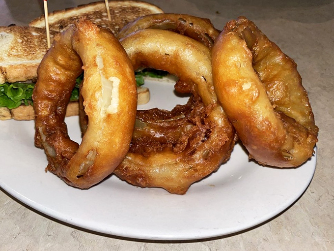 Onion rings with the structural integrity of Olympic gold&mdash;crispy, golden halos that make fast food versions weep with inadequacy.