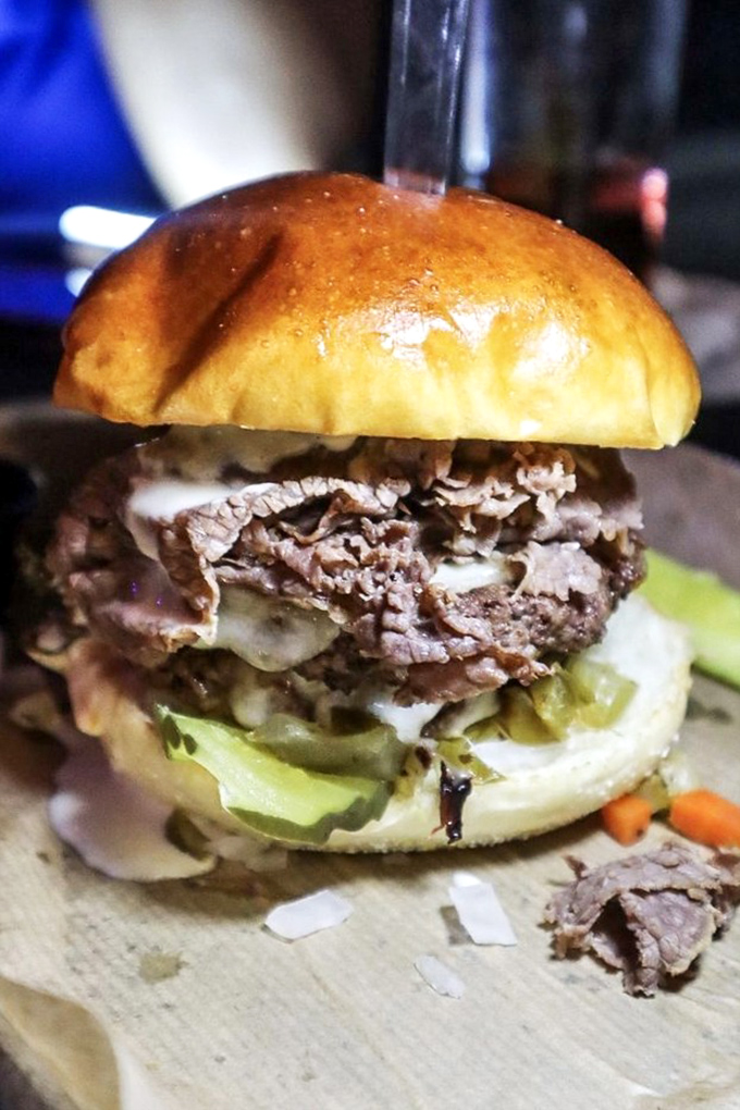 Tender brisket nestled in a pillowy bun&mdash;proof that patience (and proper smoking techniques) really is a virtue worth waiting for.