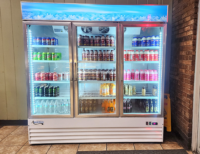The beverage cooler stands ready to help wash down your donut selection. Because even perfection needs a proper liquid accompaniment.