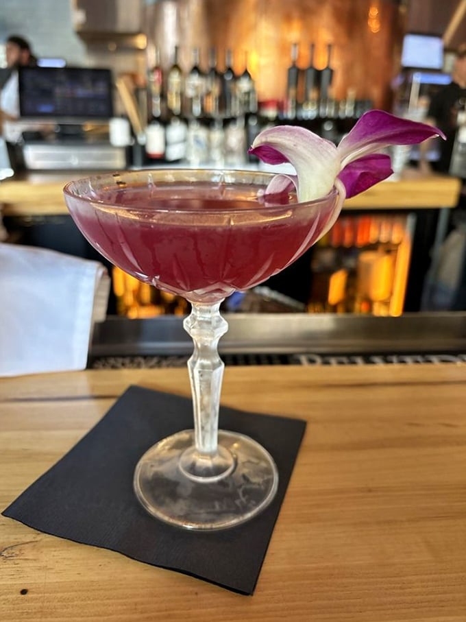 A cocktail that's dressed better than most people at the Oscars. That orchid garnish isn't just showing off&mdash;it's setting the stage for the flavor performance to come.