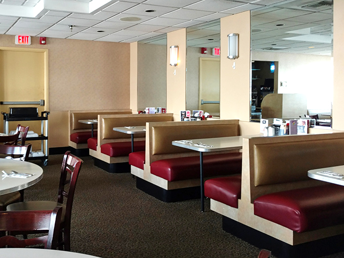 Classic diner booths where countless conversations, first dates, and food comas have unfolded&mdash;the red vinyl practically radiating decades of comfort.