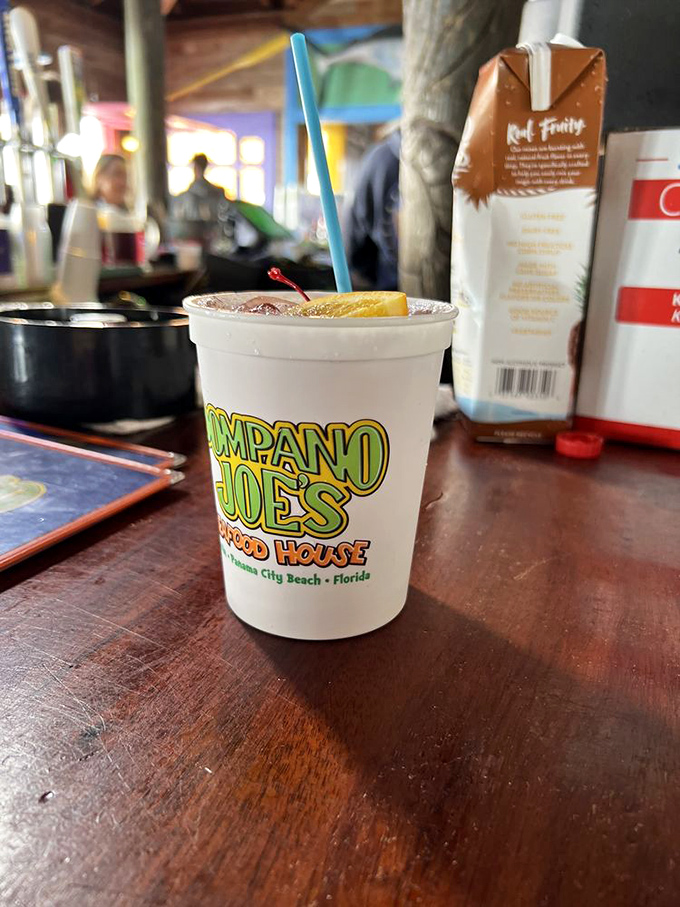 A frosty Pompano Joe's signature drink, where vacation meets hydration and your worries dissolve faster than the ice.