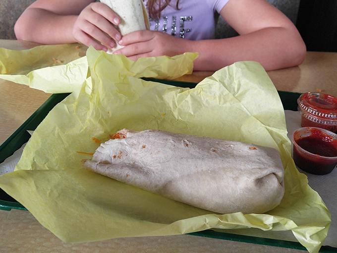 A breakfast burrito wrapped tight and packed with enough hearty ingredients to fuel your entire morning adventure. 