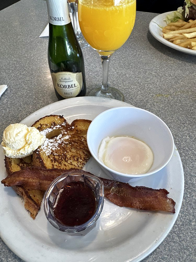 The breakfast trinity: perfect French toast, crispy bacon, and a mimosa. Name a more iconic morning trio&mdash;I'll wait.