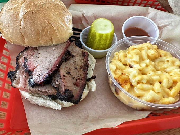 A brisket sandwich that demands your full attention, paired with mac and cheese that refuses to be relegated to "side dish" status.