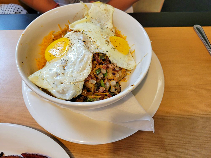 A breakfast bowl that means business&mdash;perfectly fried eggs atop a mountain of savory goodness. The kind of meal that powers you through until dinner.